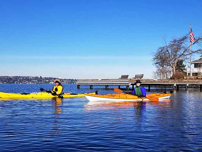 Bright kayaks on blue water under open sky&mdash;this is what freedom looks like in the Pacific Northwest.