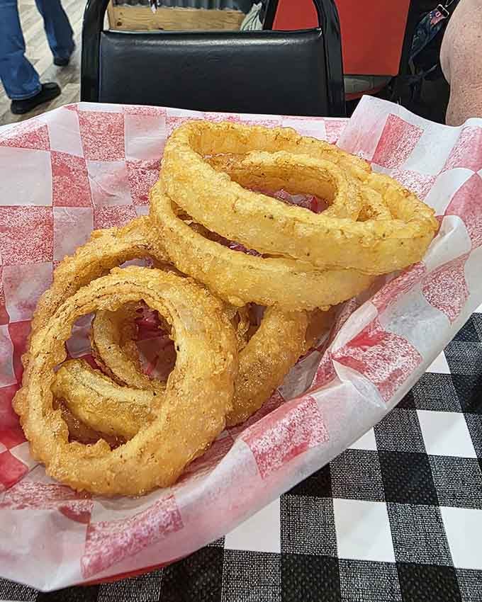 Onion rings so massive they could double as Olympic training equipment for gymnasts with excellent taste.