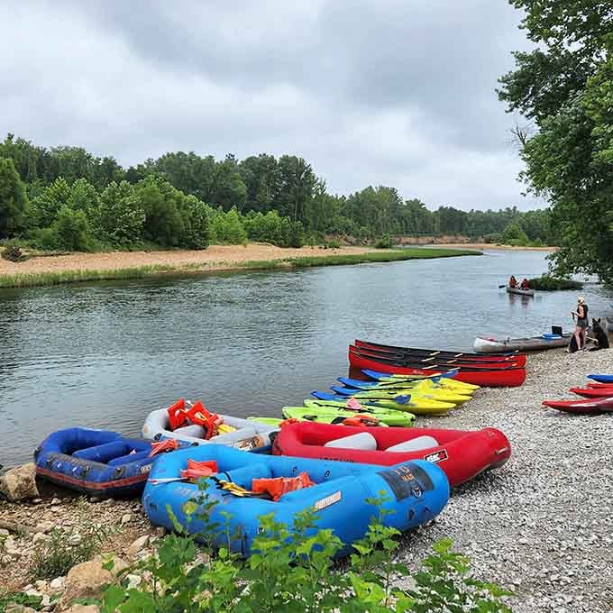 Nothing says "perfect summer day" quite like a rainbow of kayaks and rafts waiting by the water's edge.
