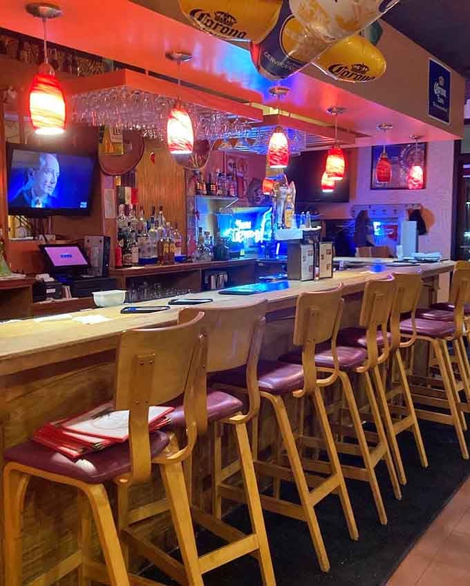 The bar area glows with welcoming lights, ready to mix up happiness one margarita at a time for thirsty souls.