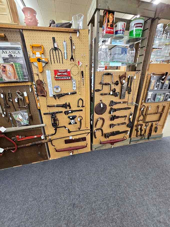 Old tools mounted on pegboard remind us when fixing things required actual skill instead of YouTube tutorials.