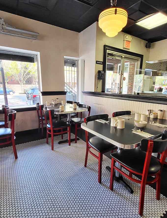 Window booths and cozy tables create intimate spaces where coffee refills flow freely and conversations linger naturally.