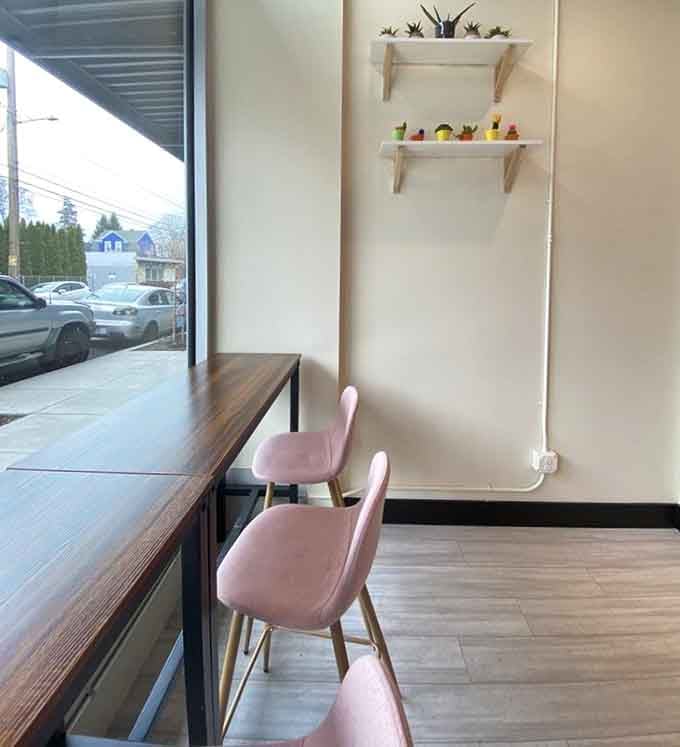 Pink velvet chairs at the window counter offer prime people-watching real estate while you savor every chewy, delicious bite.