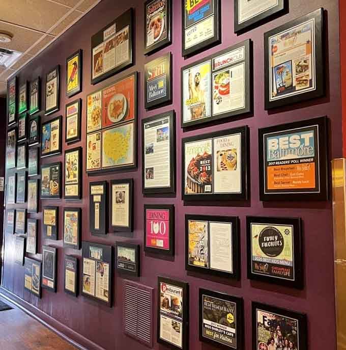 This accomplishment wall tells the story of excellence, one award and accolade at a time displayed.