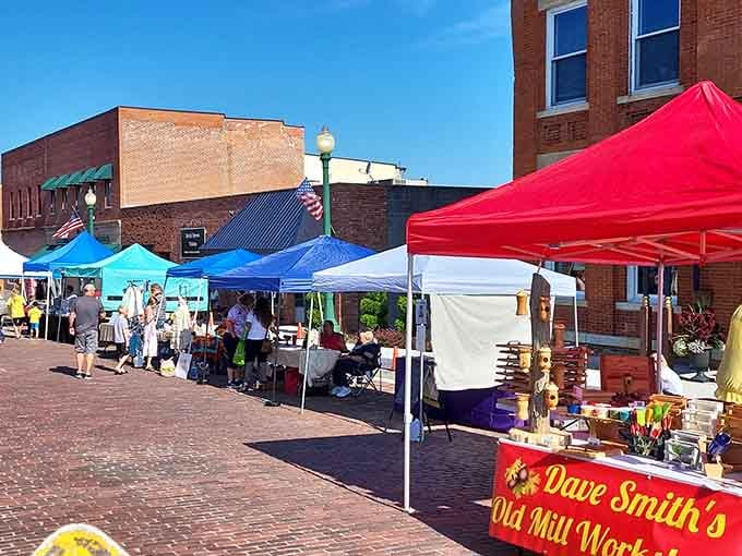 Farmers markets on brick streets feel like time travel, except the produce is fresher than anything your grocery store offers.