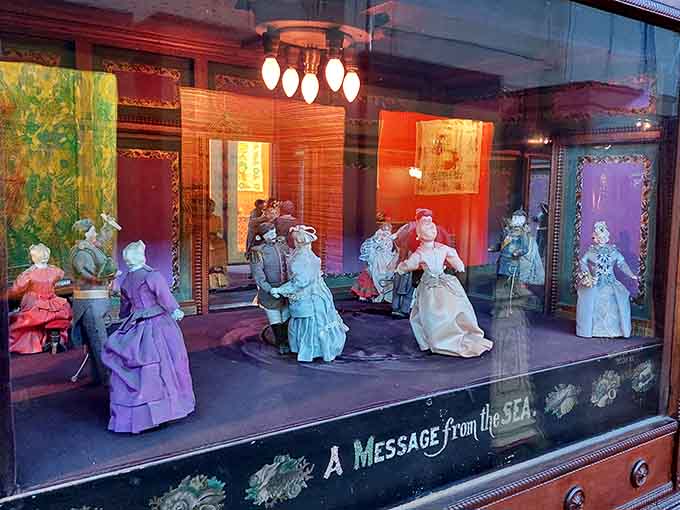 Victorian couples eternally waltz in this elaborate diorama, their mechanical romance playing out in endless graceful loops.