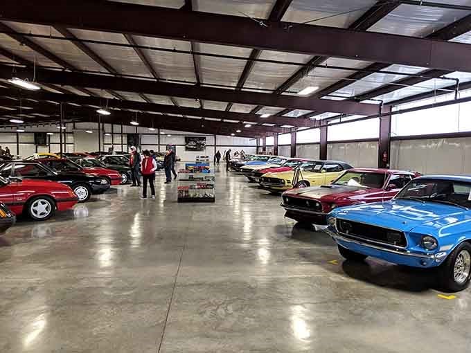 An entire warehouse transformed into a time machine powered by chrome, steel, and pure American ambition.