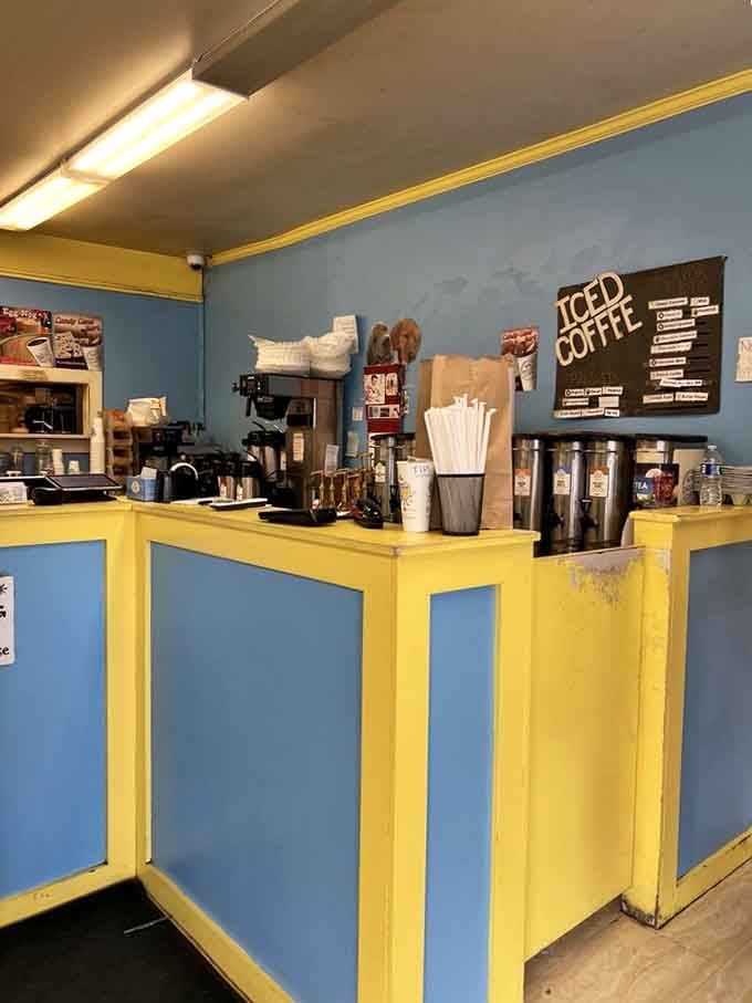 The coffee station stands ready like a caffeinated command center, fueling the donut decisions happening just feet away.