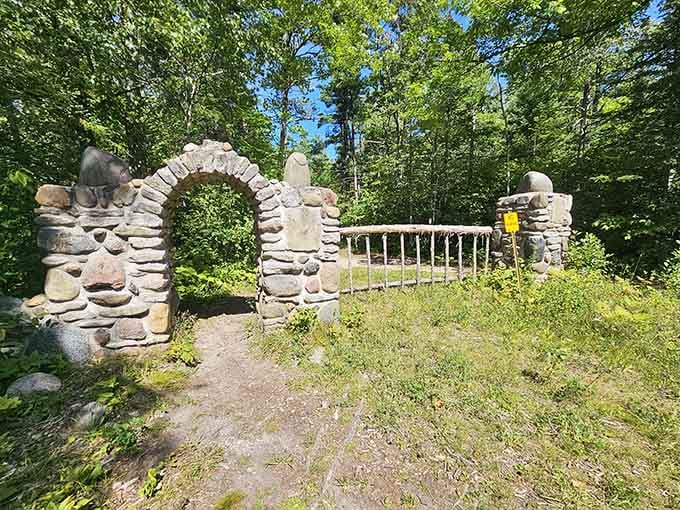 This historic stone archway stands as a reminder of the families who once called this wilderness home.
