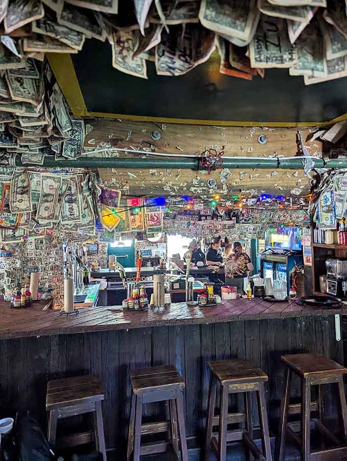 The bar where dollar bills cascade from above like the world's strangest but most entertaining indoor weather system.