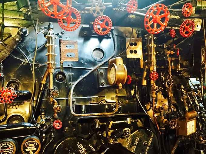 The steam engine's control panel looks like something from a Jules Verne novel, all brass and gauges and mechanical poetry.