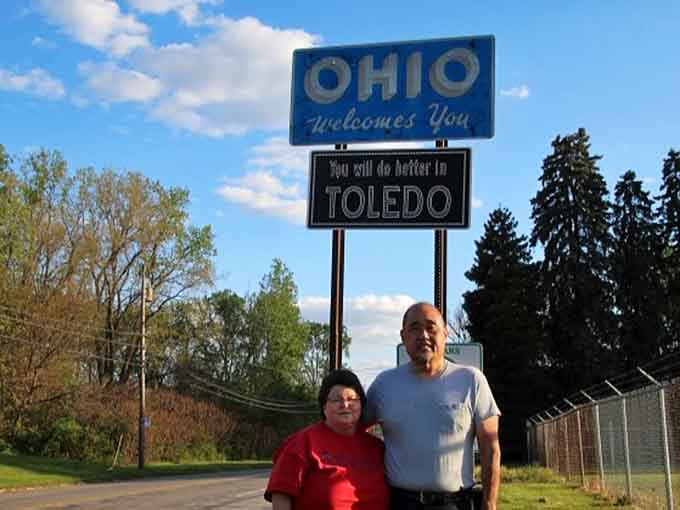 Folks travel from all over just to snap a photo with these signs, turning a simple border marker into a beloved landmark.