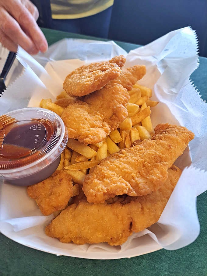 Golden chicken tenders with fries, proving that sometimes the classics exist for a reason and that reason is pure satisfaction.