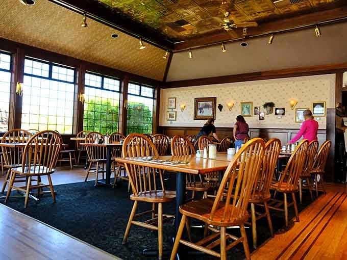 Sunlight streams through those gorgeous windows, illuminating tables where locals gather for their weekly breakfast ritual and gossip.