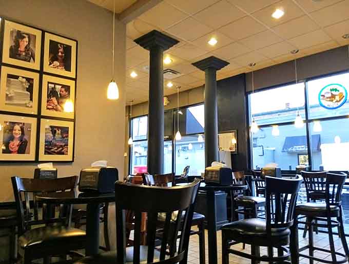 Colorful artwork adds personality to the industrial-chic space, proving bakeries can be both delicious and Instagram-worthy simultaneously.