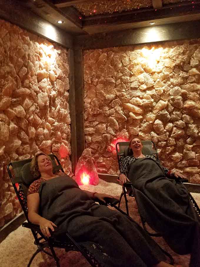 Two happy visitors discovering that the best family bonding happens in rooms made entirely of ancient salt.