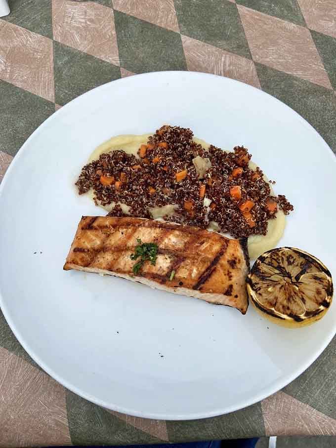 Grilled salmon with quinoa that looks like it just stepped out of a cooking magazine's centerfold spread.