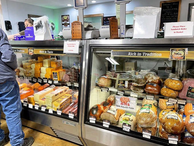 This deli case gleams with promise, showcasing specialty meats and artisan cheeses that elevate any sandwich experience.