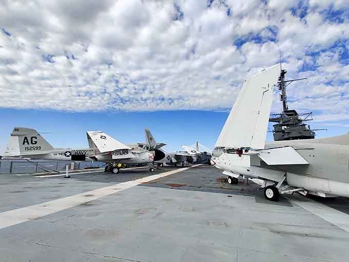 Multiple generations of naval aviation share the deck, creating an outdoor museum that textbooks could never adequately capture.