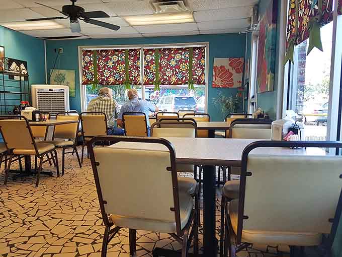 Bright, cheerful dining room with colorful window treatments that somehow make everything taste better.