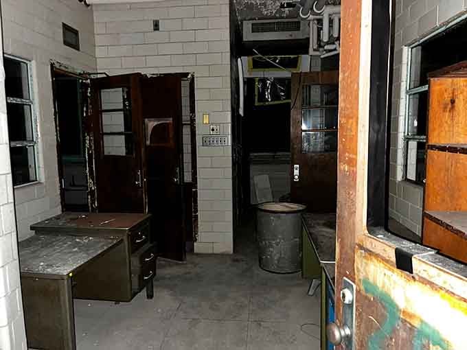 Office furniture sits abandoned as if everyone just walked away mid-shift and never looked back.