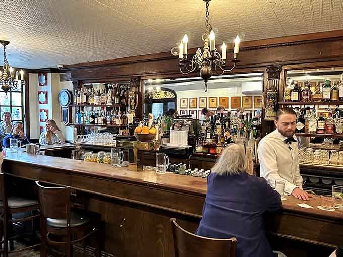 The bar area exudes timeless charm, where you can sip cocktails surrounded by decades of steakhouse history and tradition.