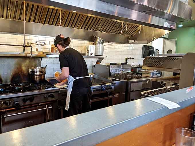 The open kitchen means you can watch your breakfast being assembled by people who take biscuits very seriously.