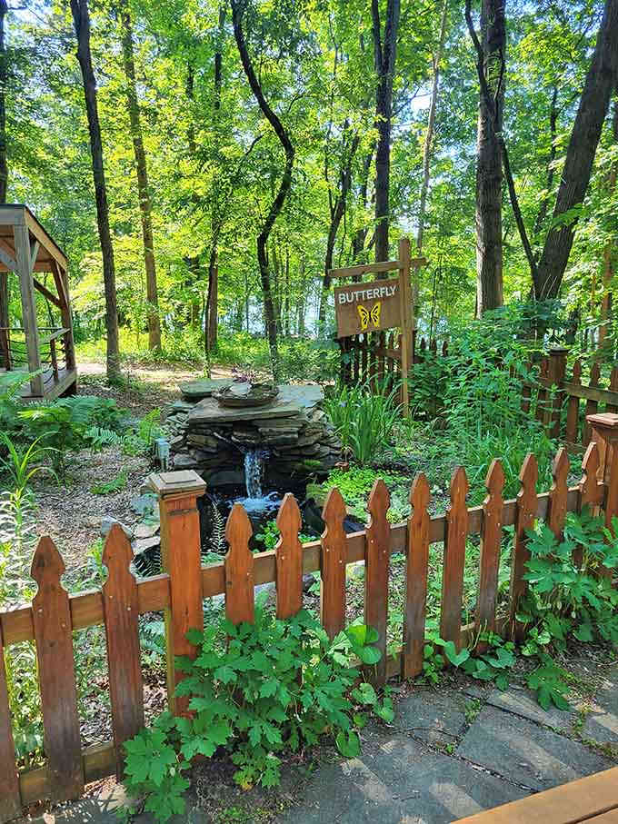 The butterfly garden's small waterfall adds gentle soundtrack to your nature walk, better than any meditation app.