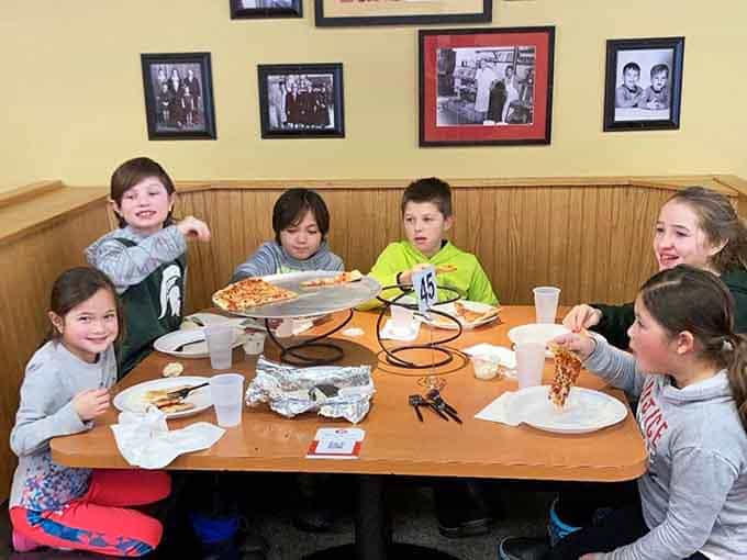 When kids this happy are surrounded by pizza, you know the restaurant understands what really matters in life.