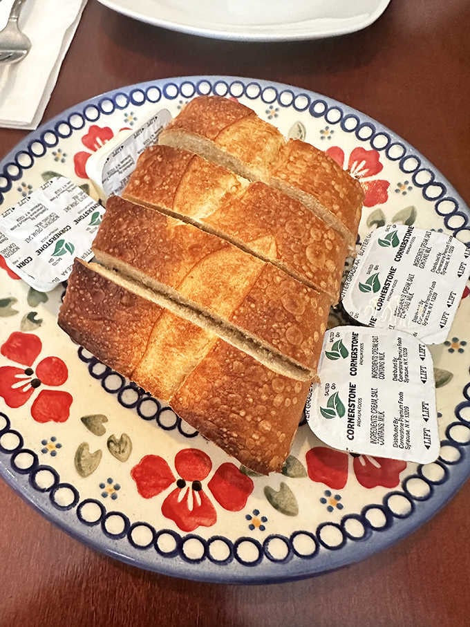 Fresh bread arrives at your table like a warm hug, ready to soak up every delicious sauce.