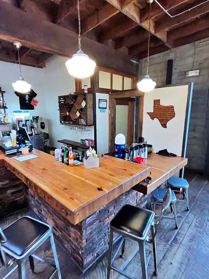 The bar area features a Texas outline on the wall, reminding everyone where this delicious tradition began.
