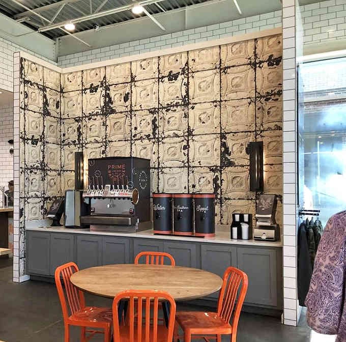 Vintage tin ceiling tiles add character to the drink station, because even hydration deserves some Southern charm.