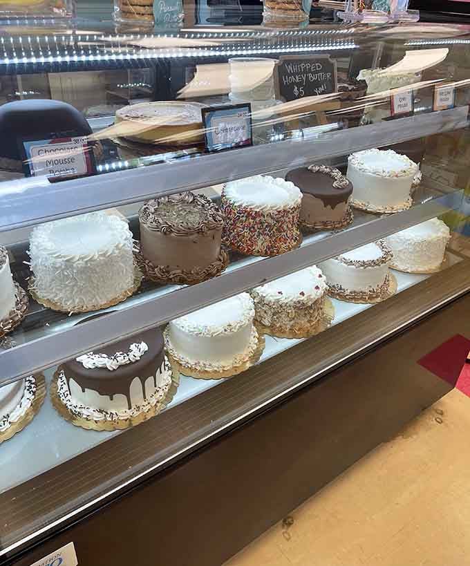 Layer cakes standing tall in the display case like edible skyscrapers waiting for their moment of glory.