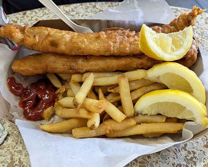 Golden-fried fish with crispy fries and lemon wedges is the kind of classic that never goes out of style.