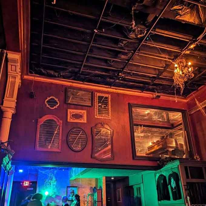 Empty frames on purple walls create an art gallery vibe, though the real masterpiece is the atmosphere itself.