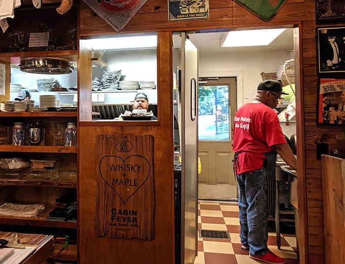 Shelves stocked with sauces and seasonings hint at the careful craft happening behind those swinging kitchen doors daily.