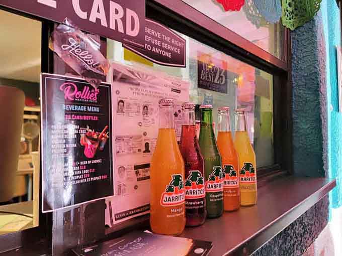 Colorful Jarritos bottles lined up like edible rainbows, the perfect sweet companion to spicy, savory perfection.
