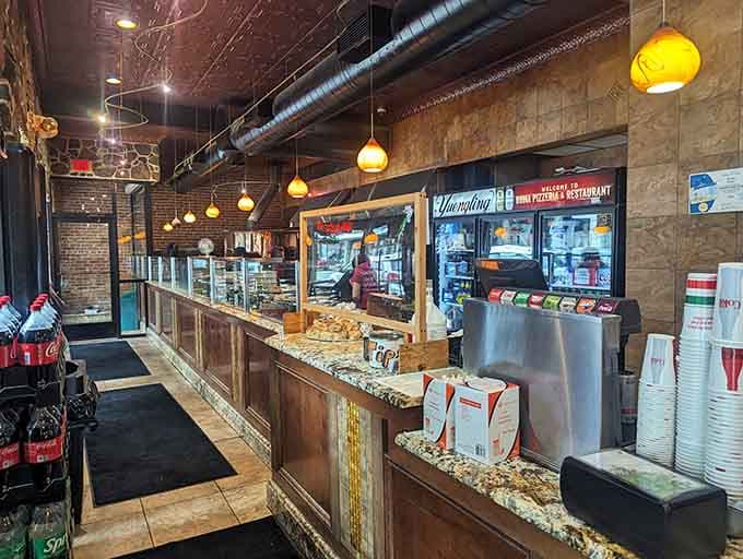 The order counter where dreams of carbs and cheese become delicious, tangible reality within minutes of ordering.