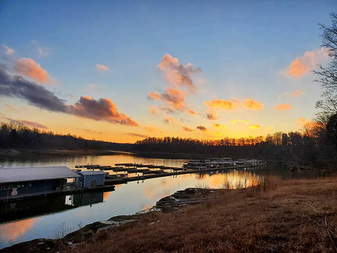 Sunset paints the marina in golden hues while boats rest peacefully, ending another perfect day on the water.