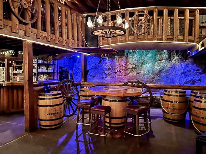 Blue lighting and barrel tables create an atmosphere that's equal parts saloon and sophisticated Western retreat.