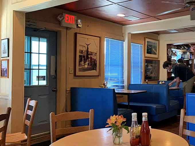 Blue booths and framed photographs create an atmosphere that feels like breakfast at your coolest uncle's beach house.