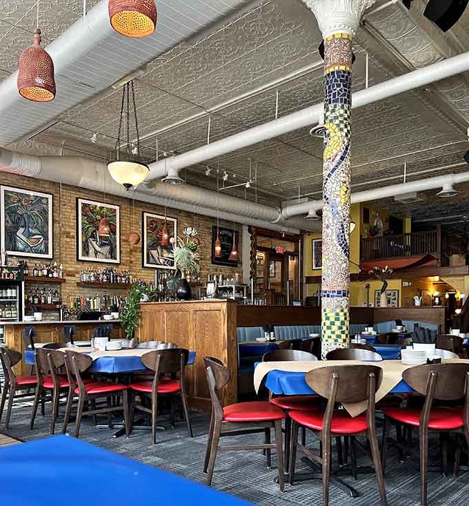 Exposed brick and colorful art create a vibe that's sophisticated without being the least bit intimidating or stuffy.