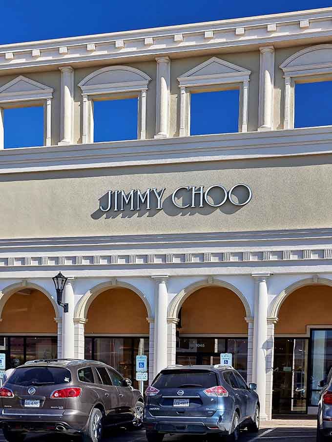 Jimmy Choo's elegant signage and classical columns bring unexpected luxury to the outlet shopping experience.