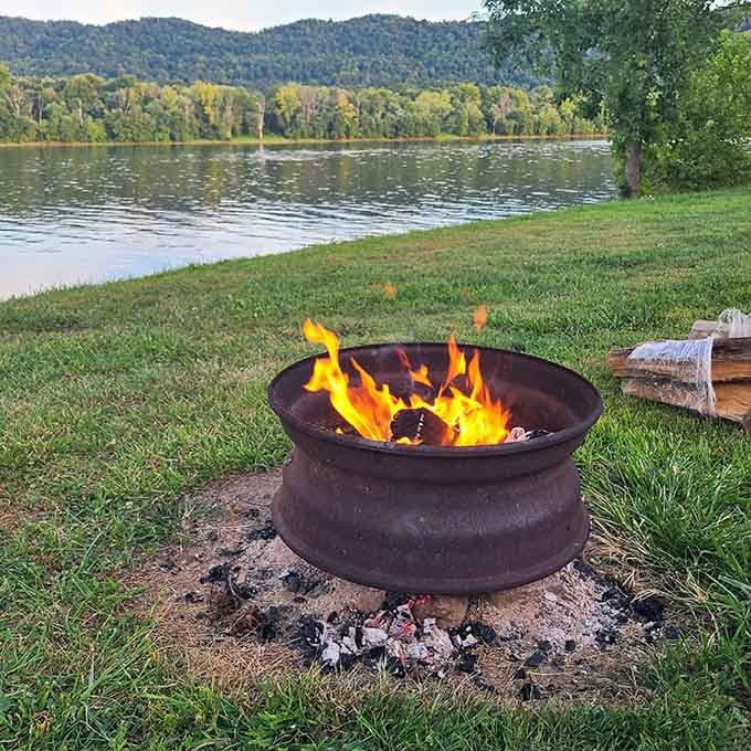 Dancing flames beside the river at dusk remind us why humans have gathered around fires since forever.