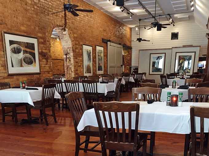 White tablecloths and dark wood chairs strike that perfect balance between casual comfort and special occasion dining vibes.
