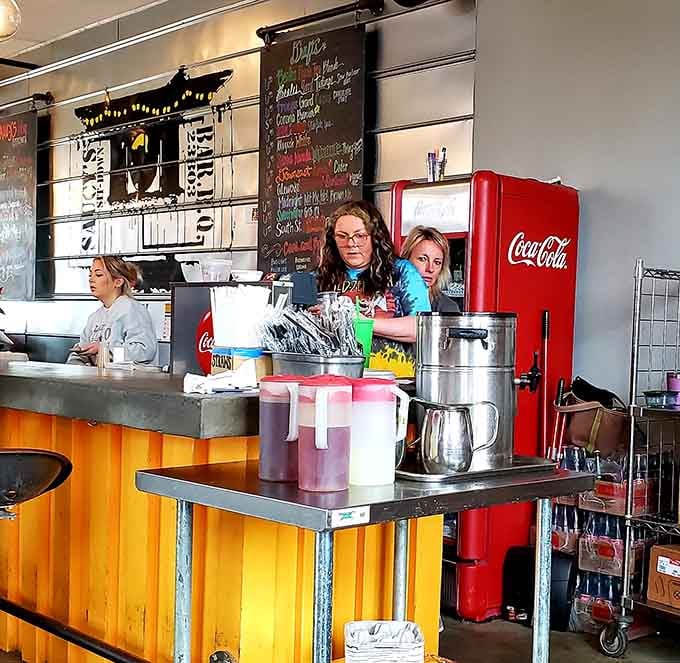 Behind that counter, the team works their magic with chalkboard menus and genuine smiles all around.