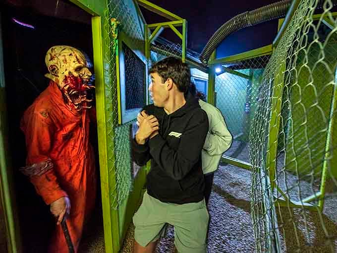 That visitor's defensive posture says it all: when zombies get this close, your fight-or-flight response kicks into overdrive immediately.