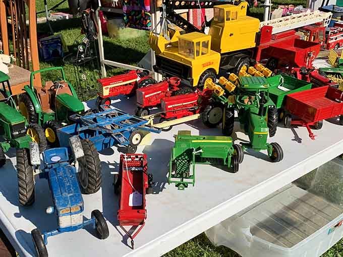 Toy tractors hauling succulents instead of crops, proving farm equipment never really retires in Wisconsin.