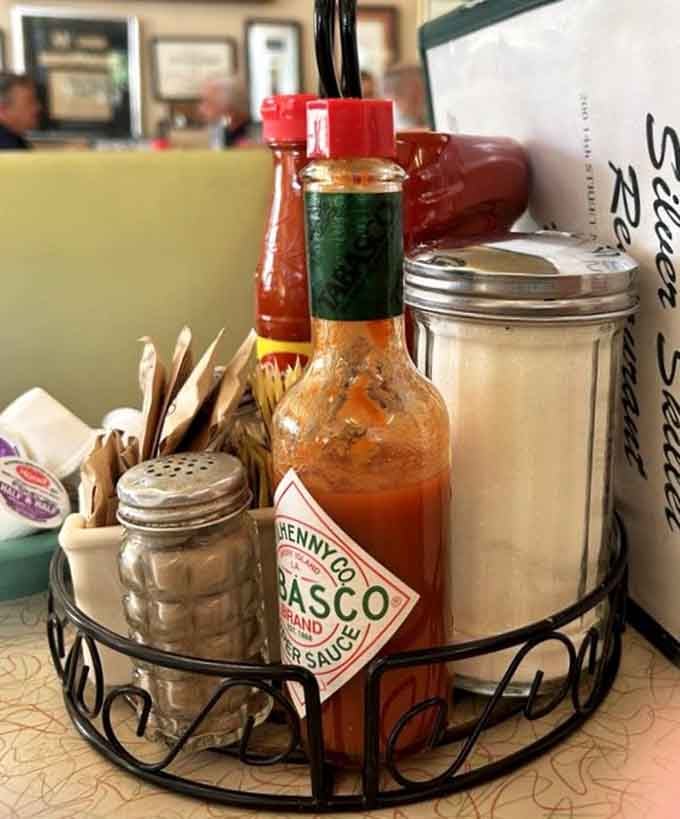 Tabasco and sugar sharing space in perfect harmony, the yin and yang of diner condiment philosophy.