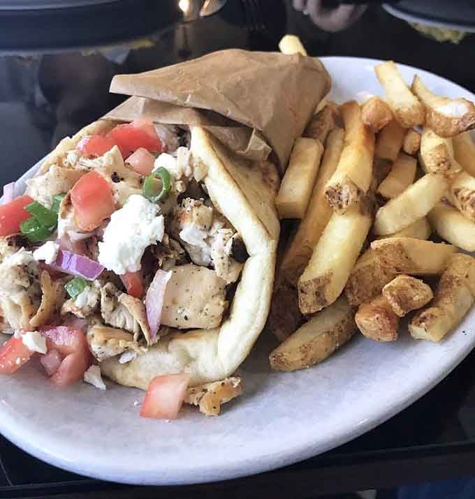 Chicken gyro wrapped in pita with feta and fries, bringing Mediterranean flair to Baltimore's diner scene with delicious authority.